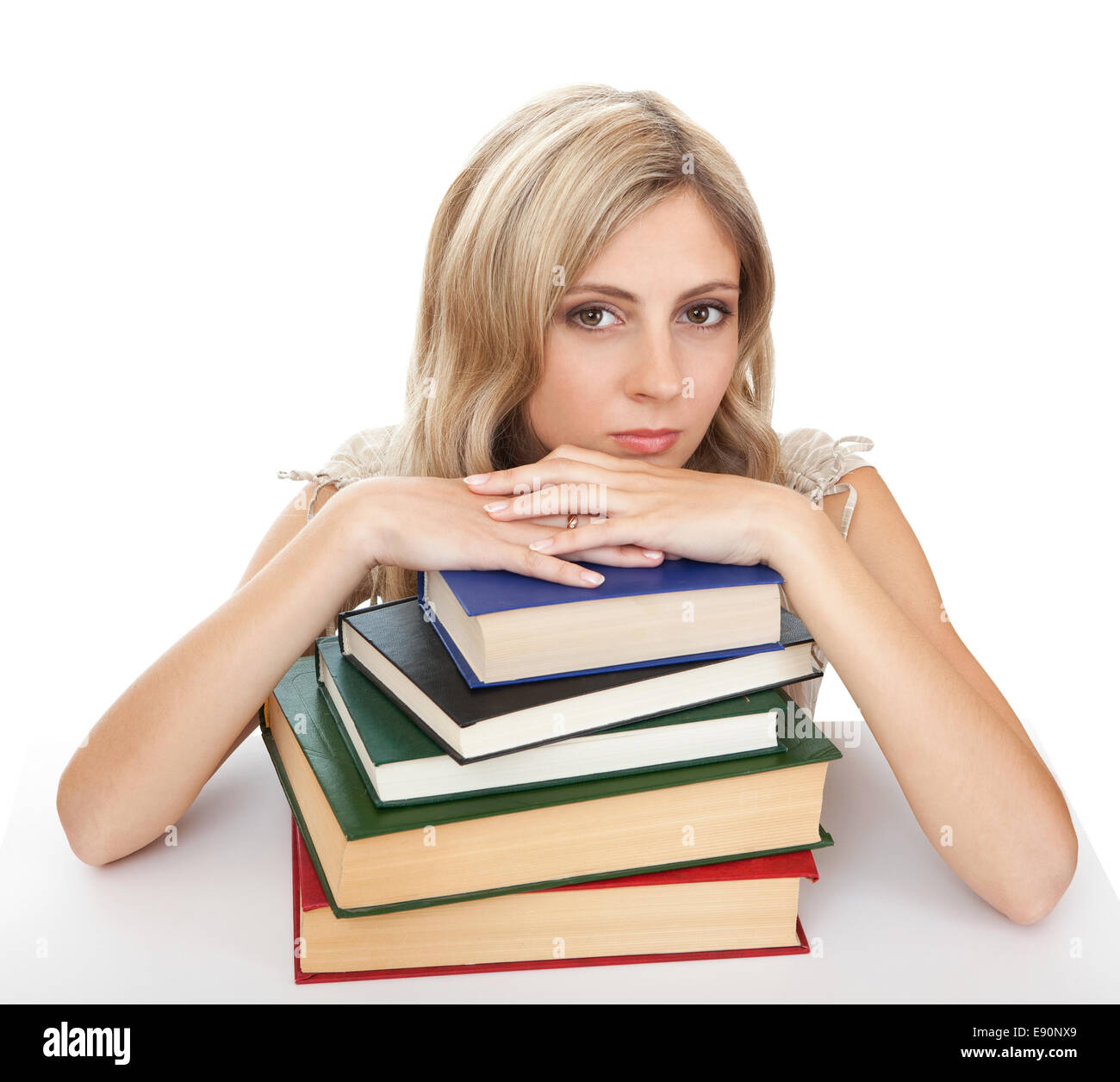 Sad student on a pile of books Stock Photo - Alamy