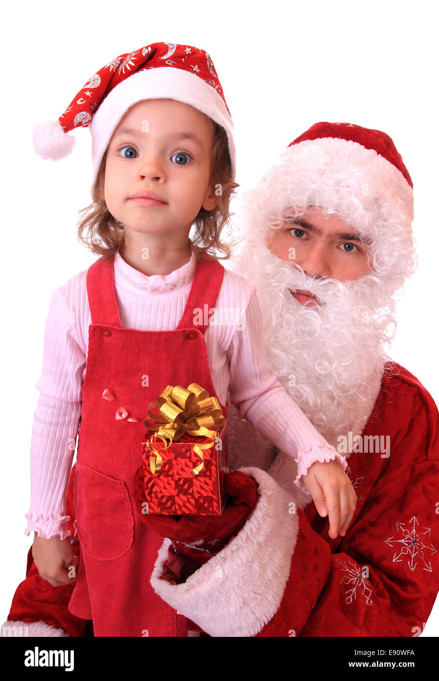Santa Claus and dwarf with a gift Stock Photo - Alamy