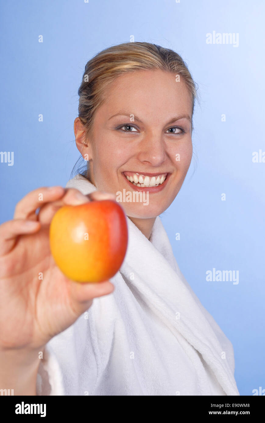 Woman with apple Stock Photo - Alamy
