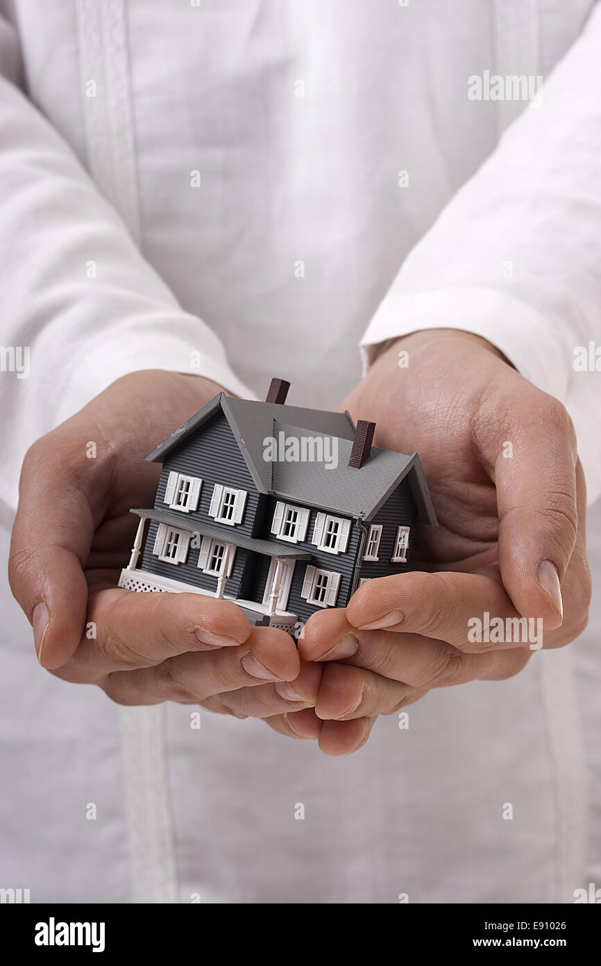 House in Hands Stock Photo - Alamy