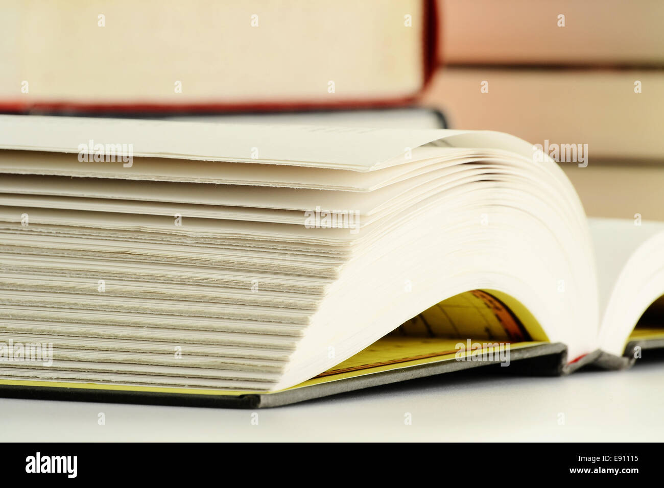 Open book on the table Stock Photo - Alamy