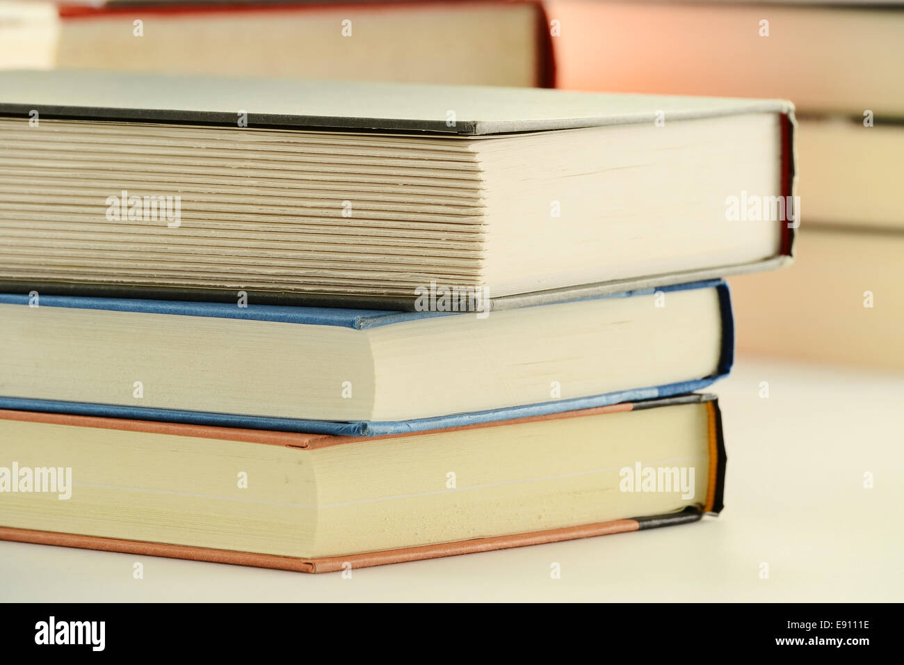 Stack of books on the table Stock Photo - Alamy