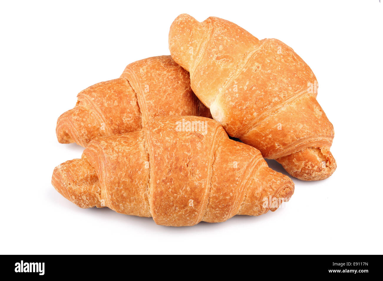 Three gold croissant isolated on white Stock Photo - Alamy