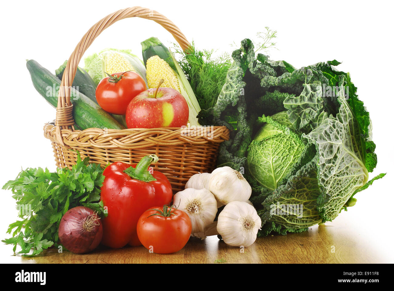 Vegetables and wicker basket Stock Photo - Alamy