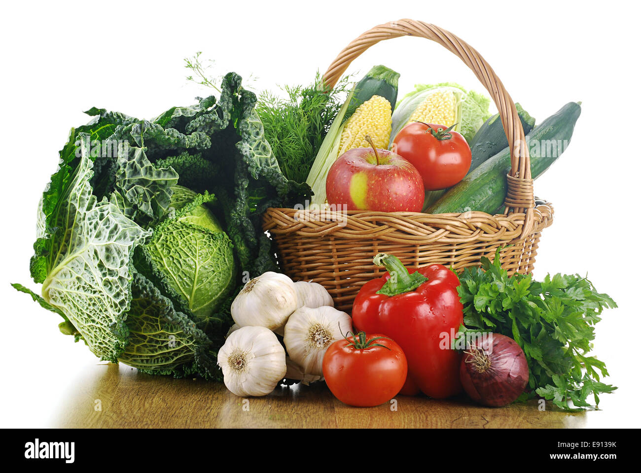 Vegetables and wicker basket Stock Photo - Alamy