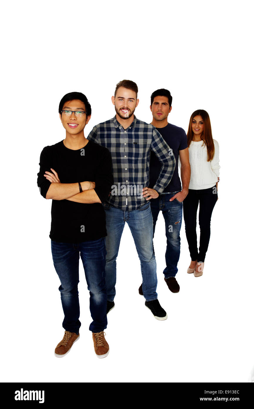 Group of a happy students standing in a row over white background Stock ...