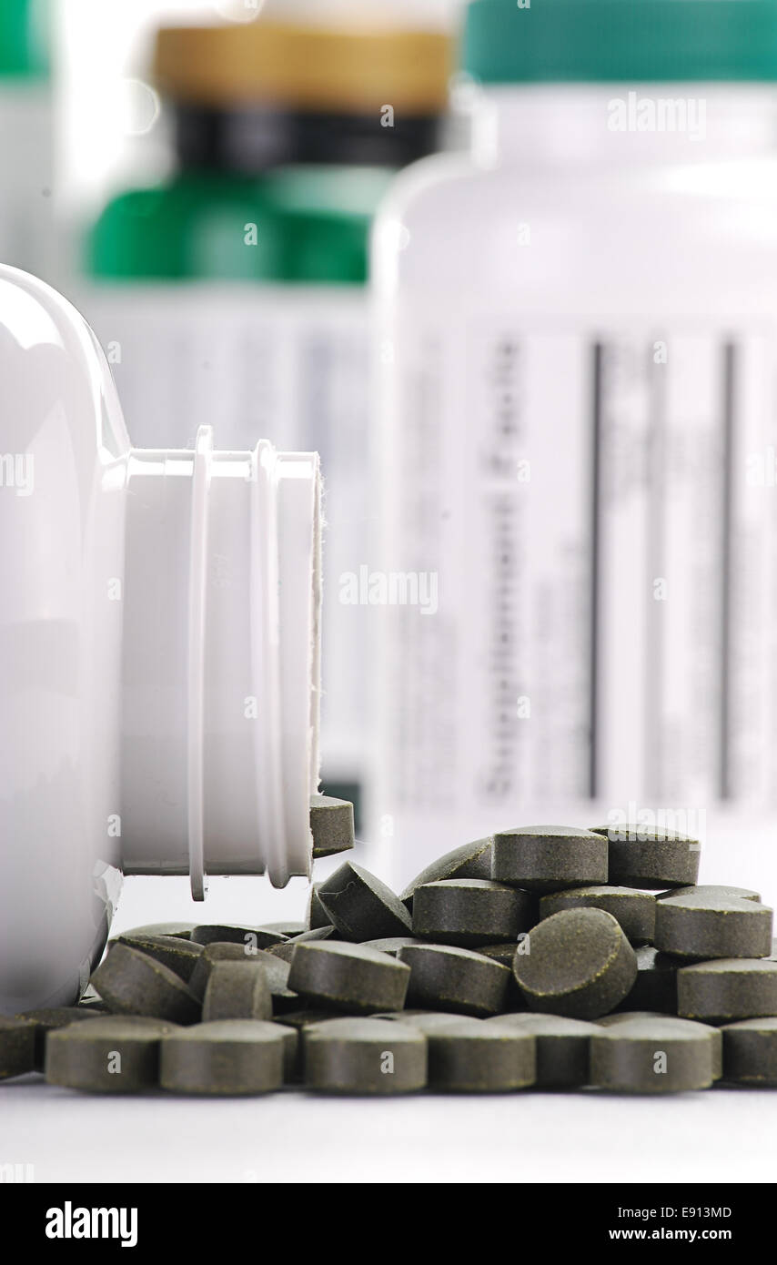 Dietary supplement tablets and containers Stock Photo - Alamy