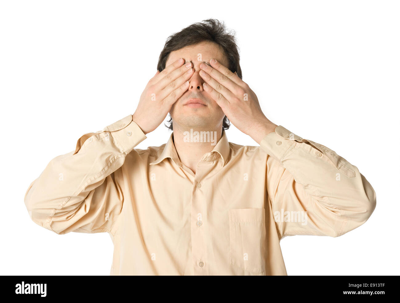 A man covering his eyes with his hands Stock Photo - Alamy
