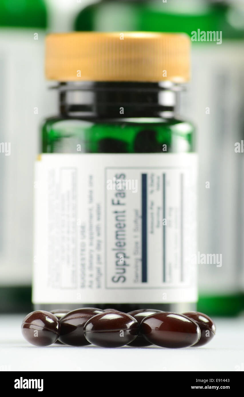 Dietary supplement capsules and containers Stock Photo - Alamy
