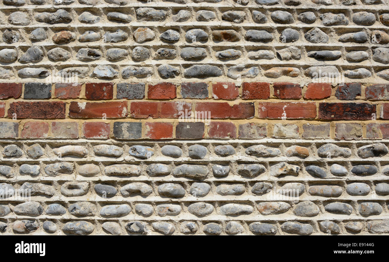 Brick and pebble or flintstone wall Stock Photo - Alamy