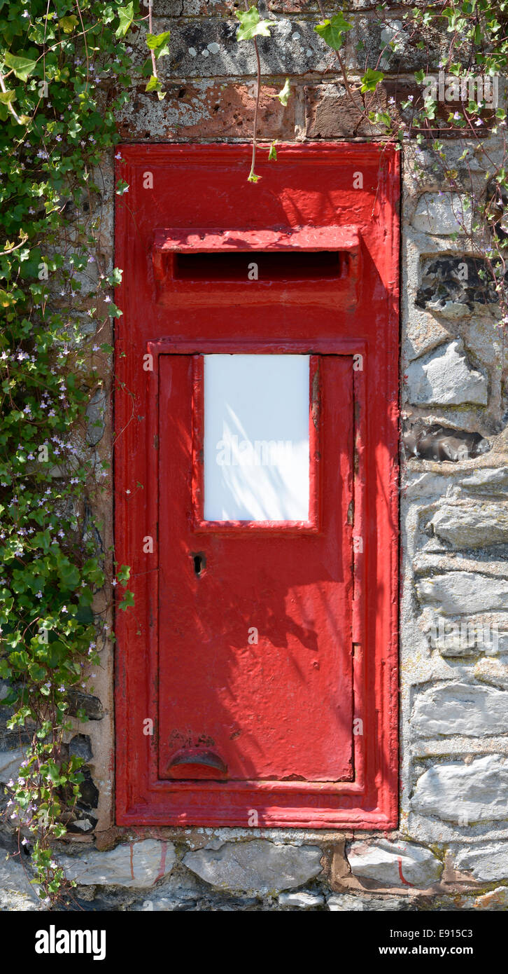 Typical British red post box in a wall Stock Photo - Alamy