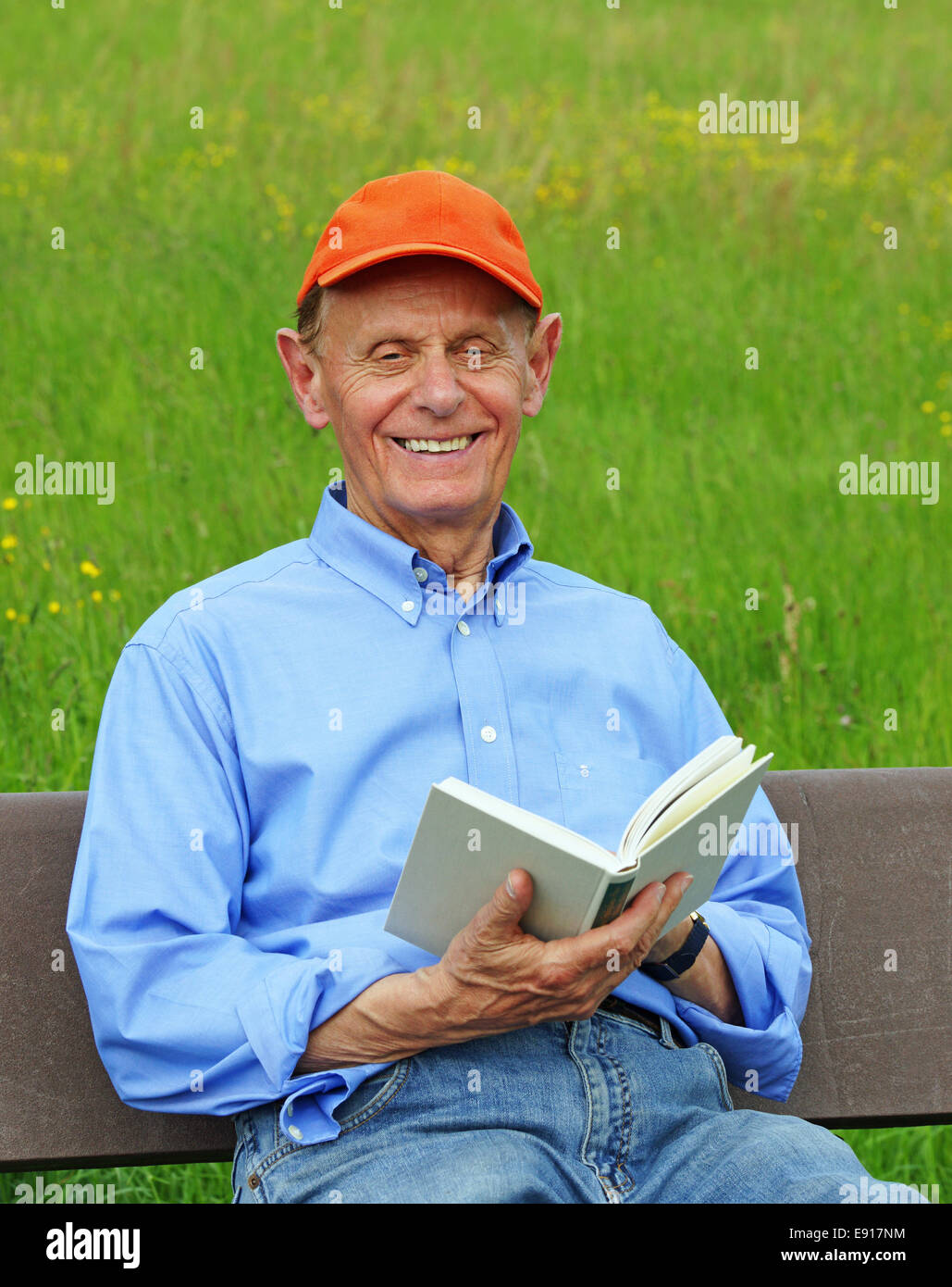 Happy Senior reading Book Stock Photo - Alamy