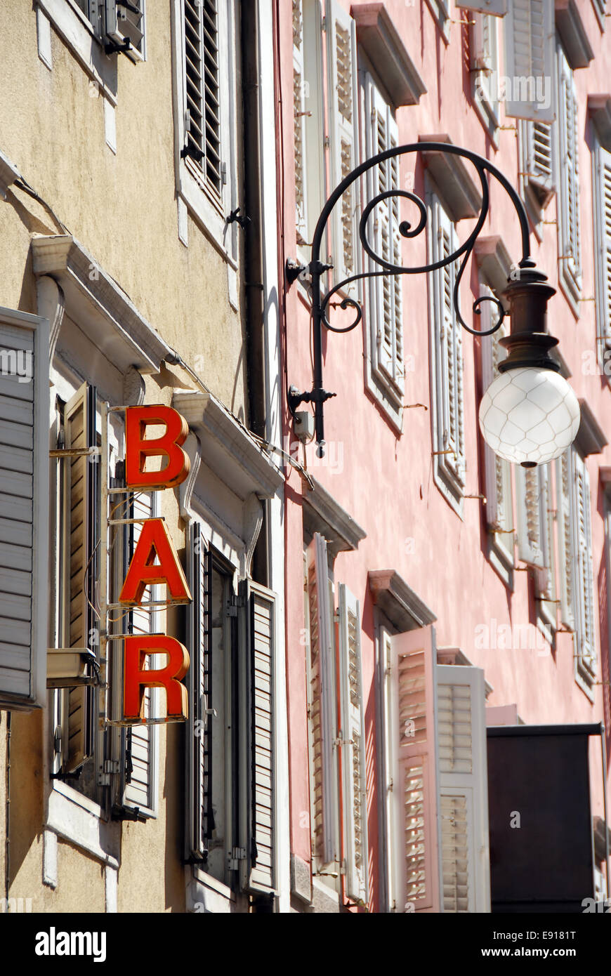 Street lamp and bar sign Stock Photo - Alamy