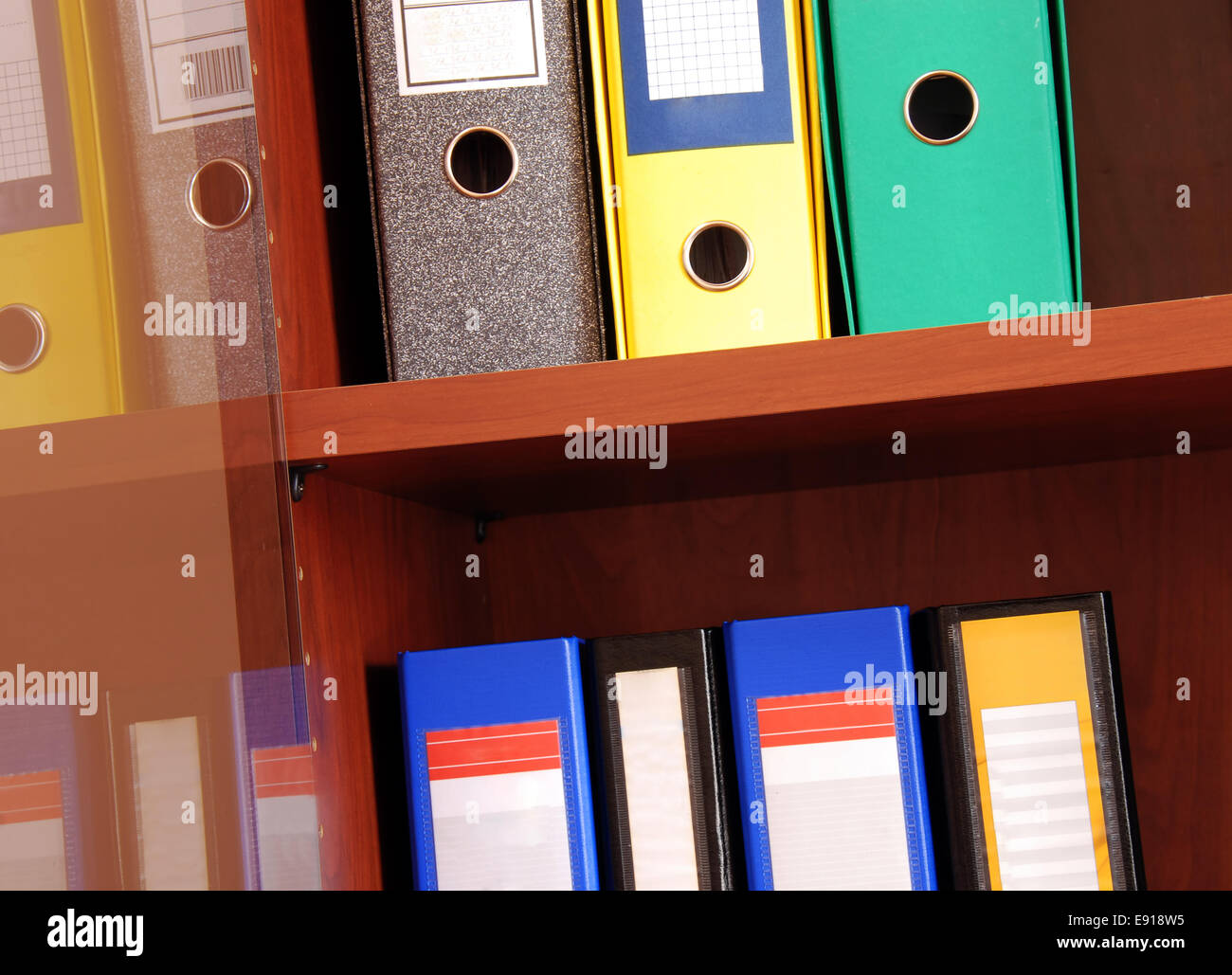 Colorful files in office shelf Stock Photo - Alamy