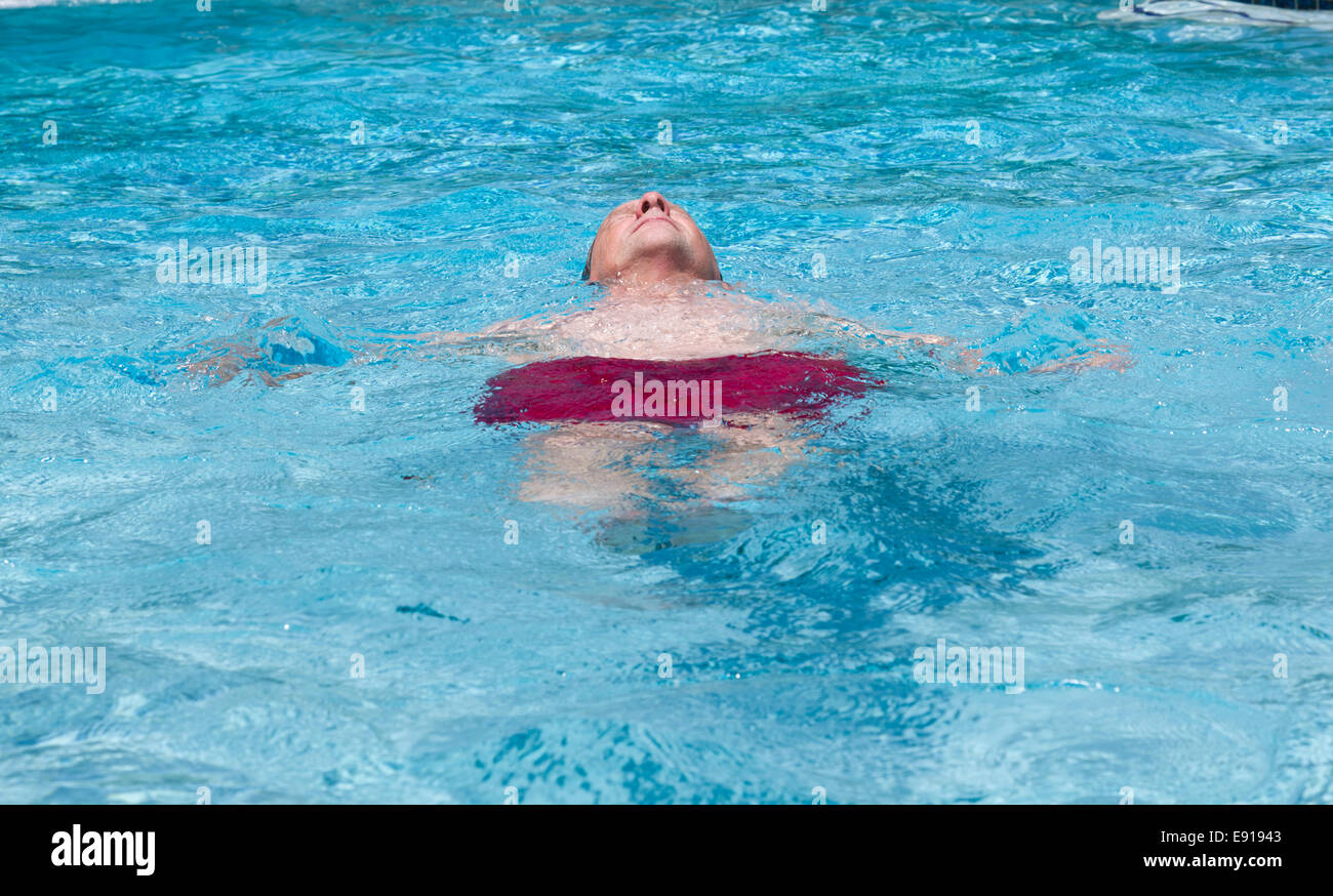 Senior in float swimming pool hi-res stock photography and images - Alamy