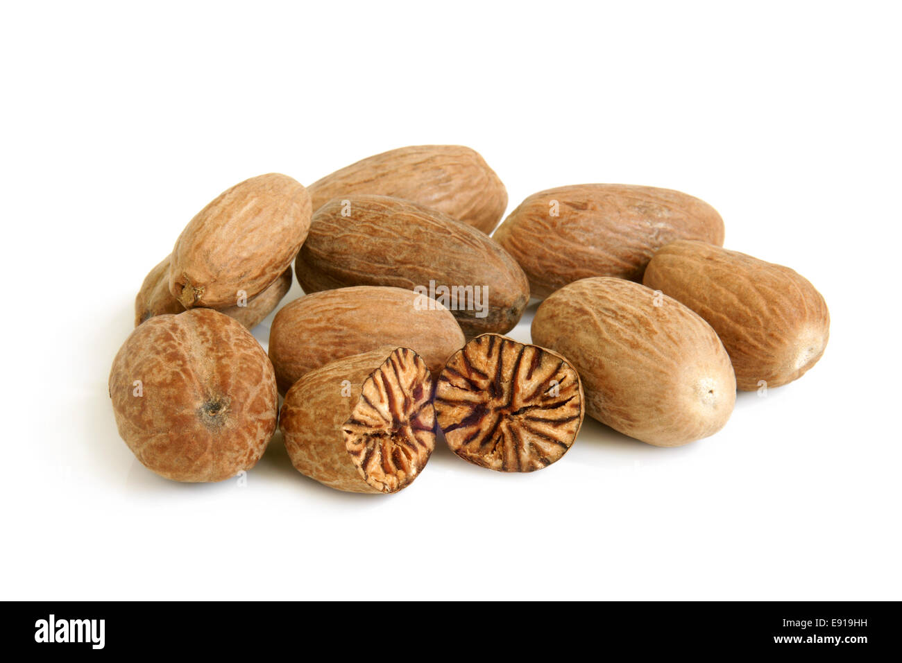 Nutmeg whole half isolated Cut Out Stock Images & Pictures - Alamy