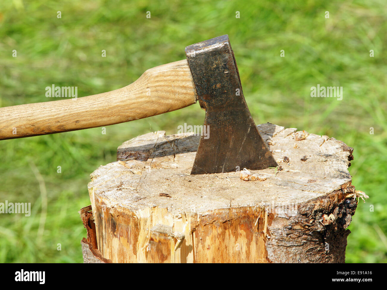 Axe in the Garden Stock Photo - Alamy