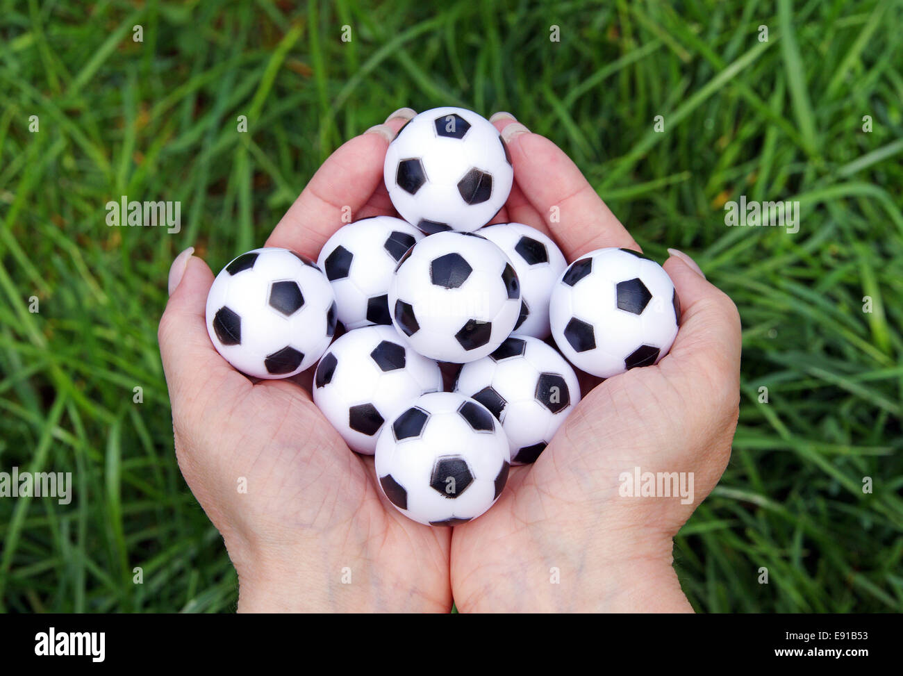 Hand hands ball fussball hi-res stock photography and images - Alamy
