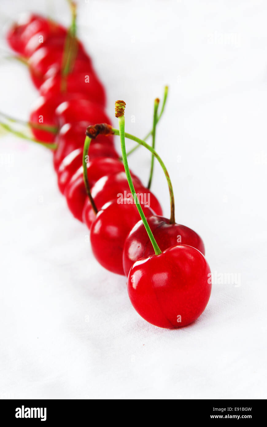 Appetizing red cherries row Stock Photo - Alamy