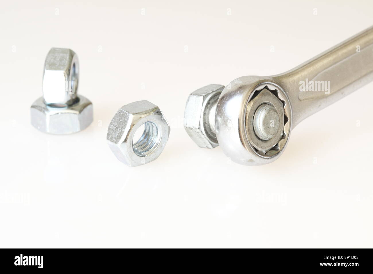 spanner with nuts Stock Photo - Alamy