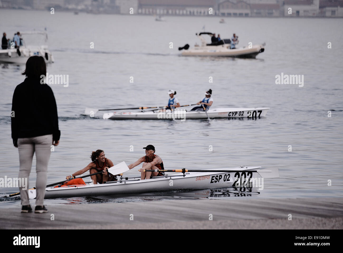 Thessaloniki, Greece. 17th Oct, 2014. A woman watches a rowing race ...