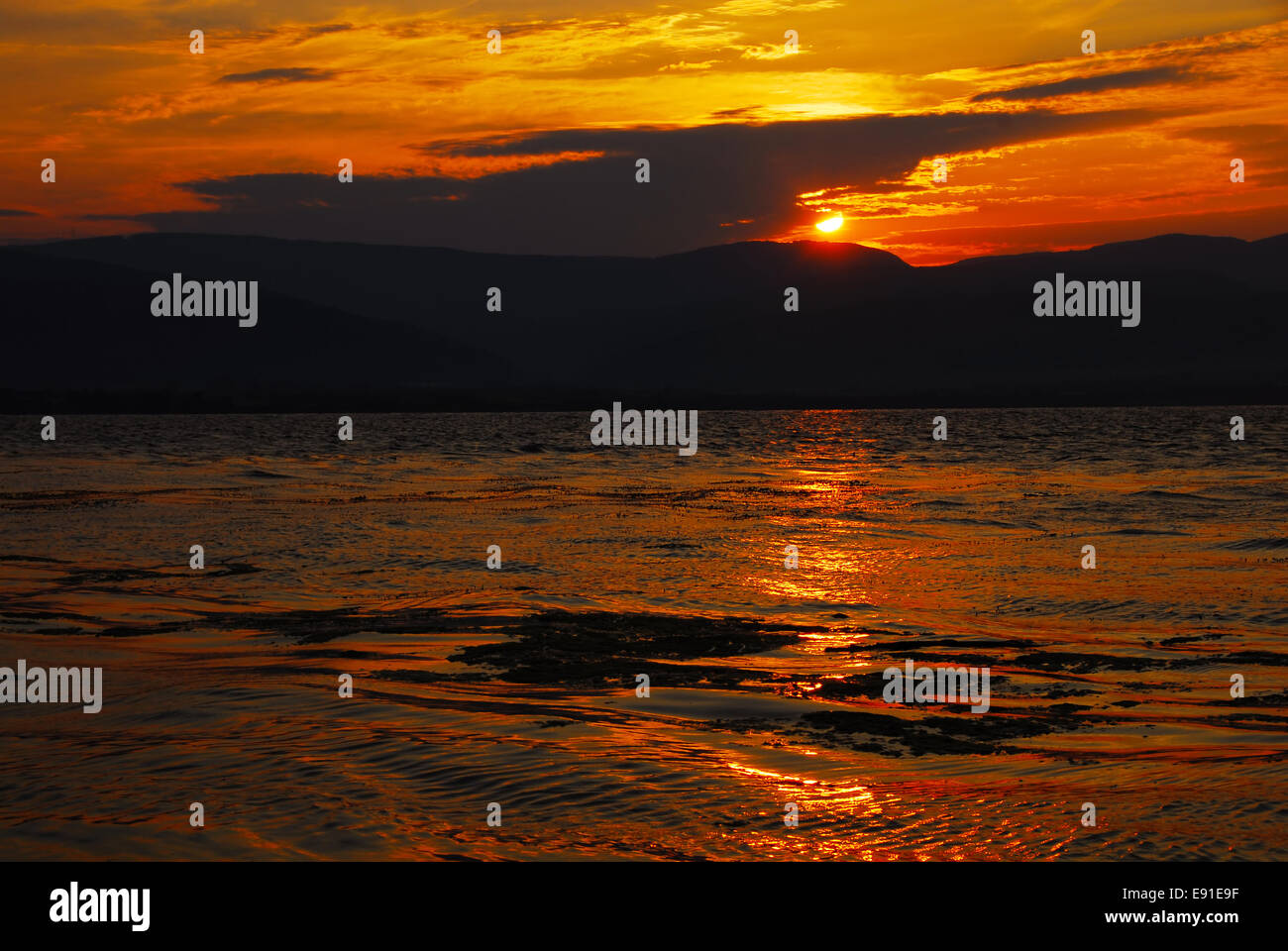 Sunrise on riverbank Stock Photo - Alamy