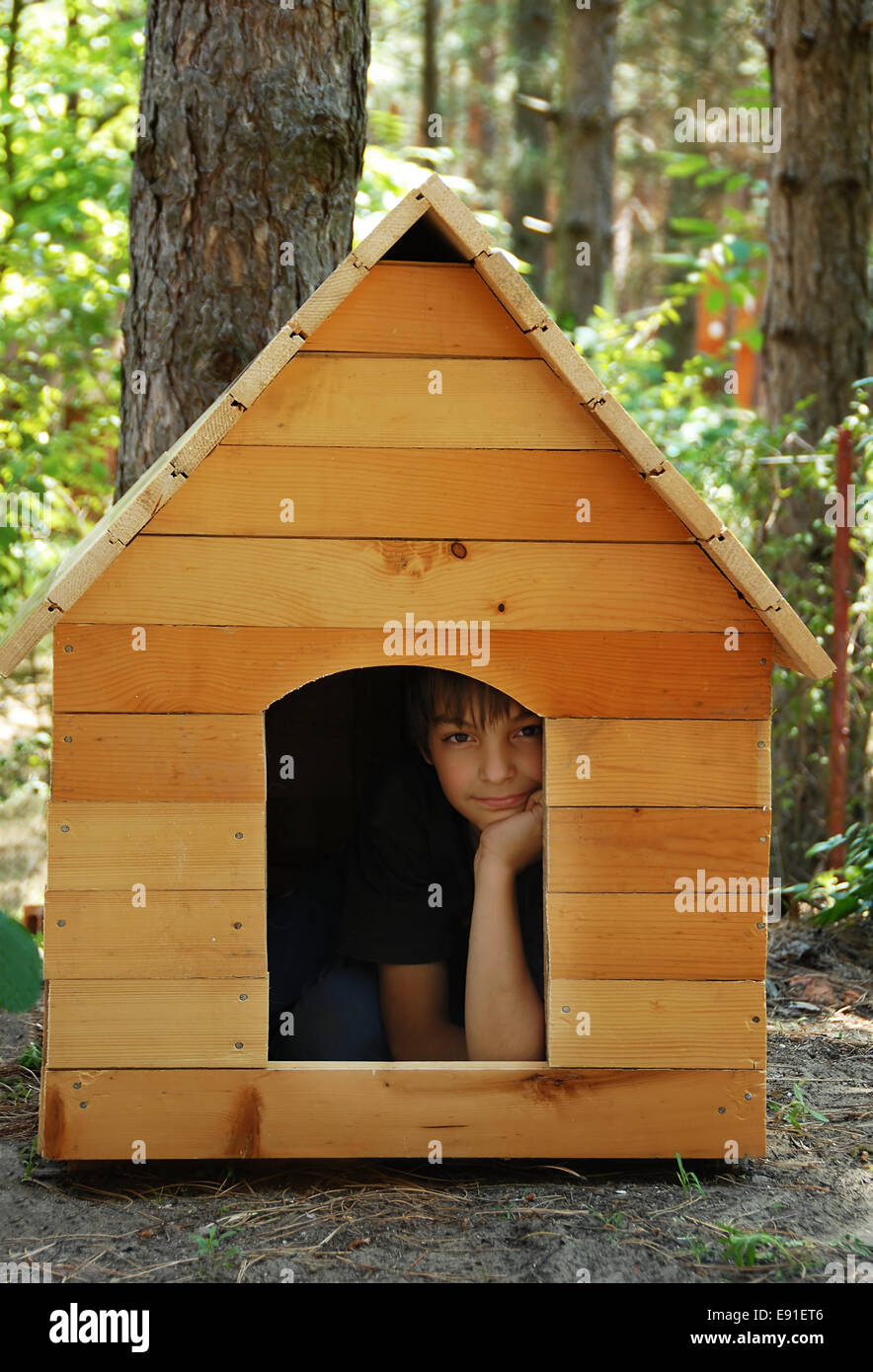 Boy in wooden house Stock Photo - Alamy