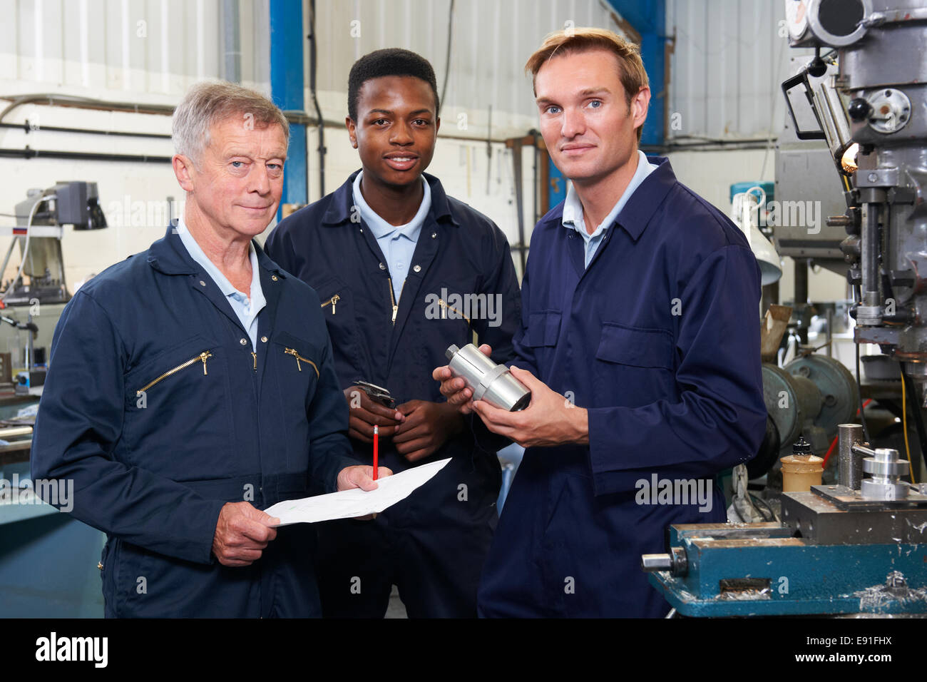 Team Of Engineers Having Discussion In Factory Stock Photo - Alamy