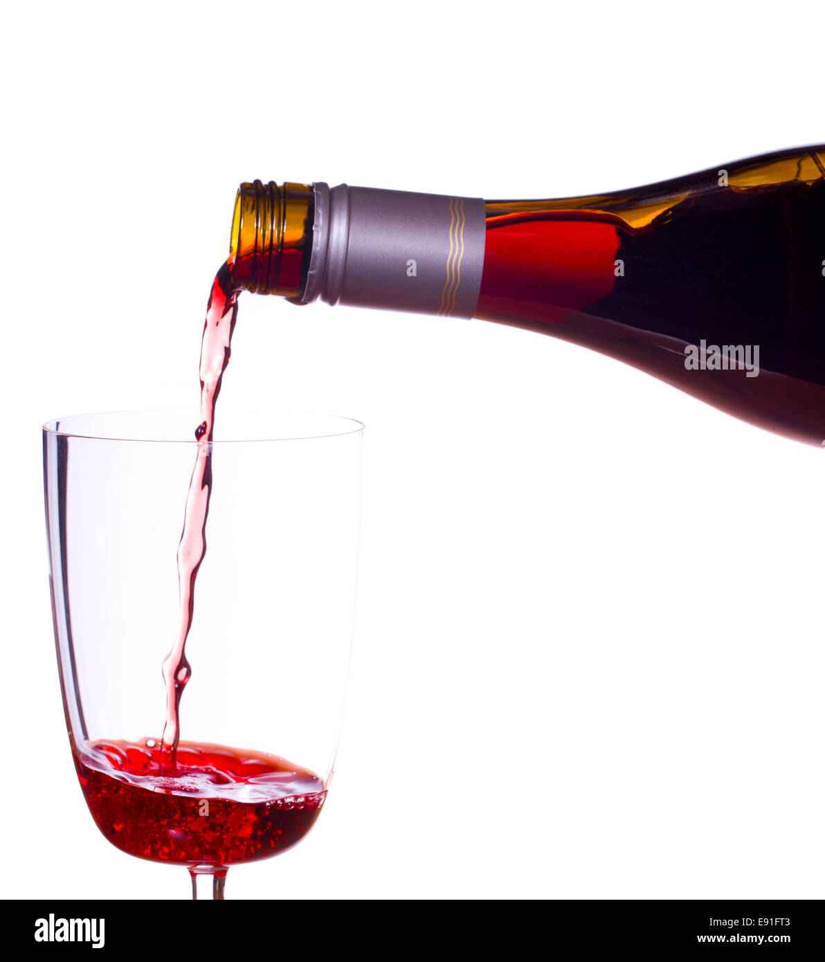 Red wine being poured into glass Stock Photo - Alamy