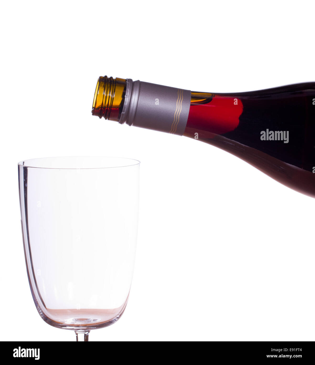 Red wine being poured into glass Stock Photo - Alamy