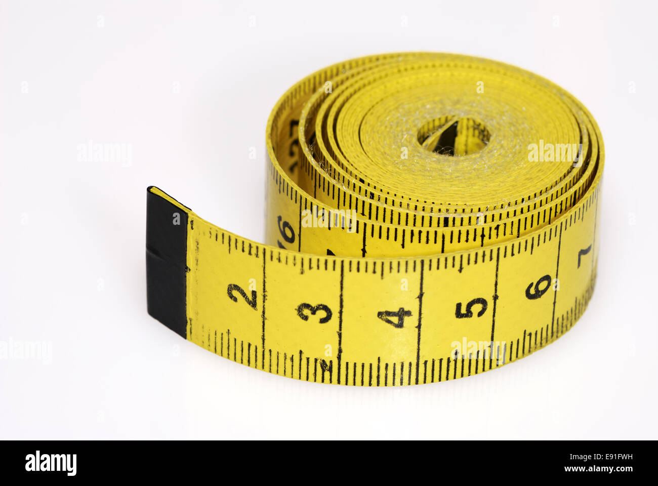 Yellow measuring tape Stock Photo - Alamy