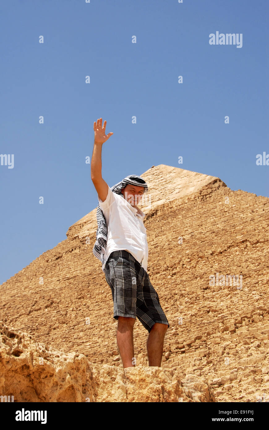 Man tourist by pyramid in Egypt Stock Photo - Alamy
