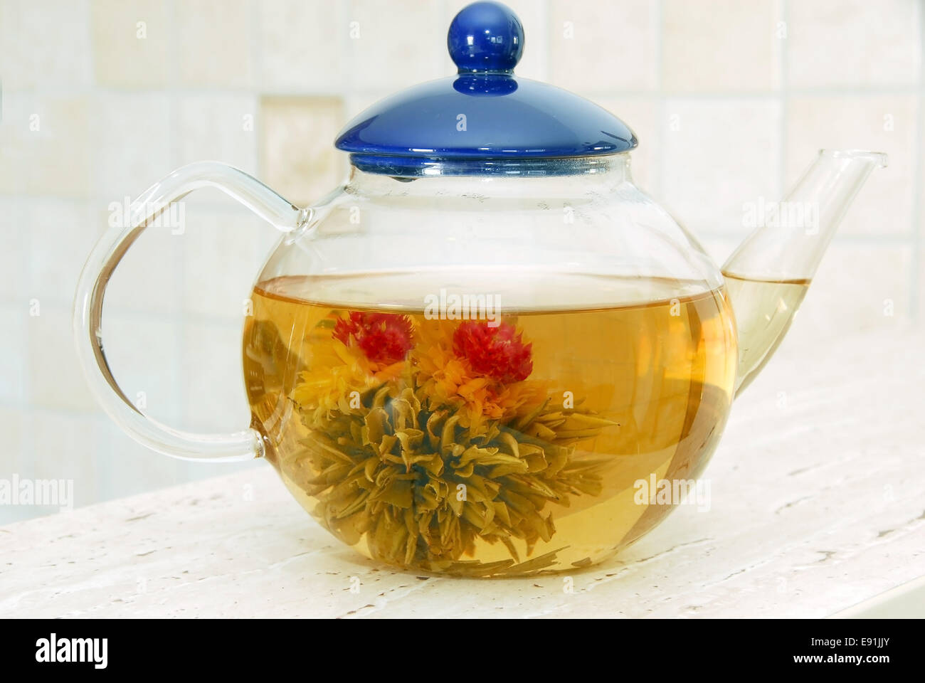 Flower tea in glass pot Stock Photo - Alamy