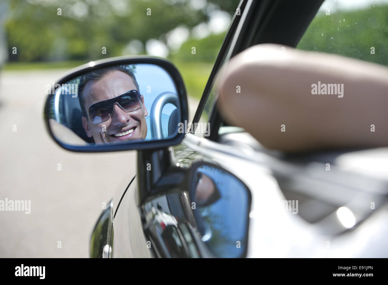 Cool guy in a car Stock Photo - Alamy