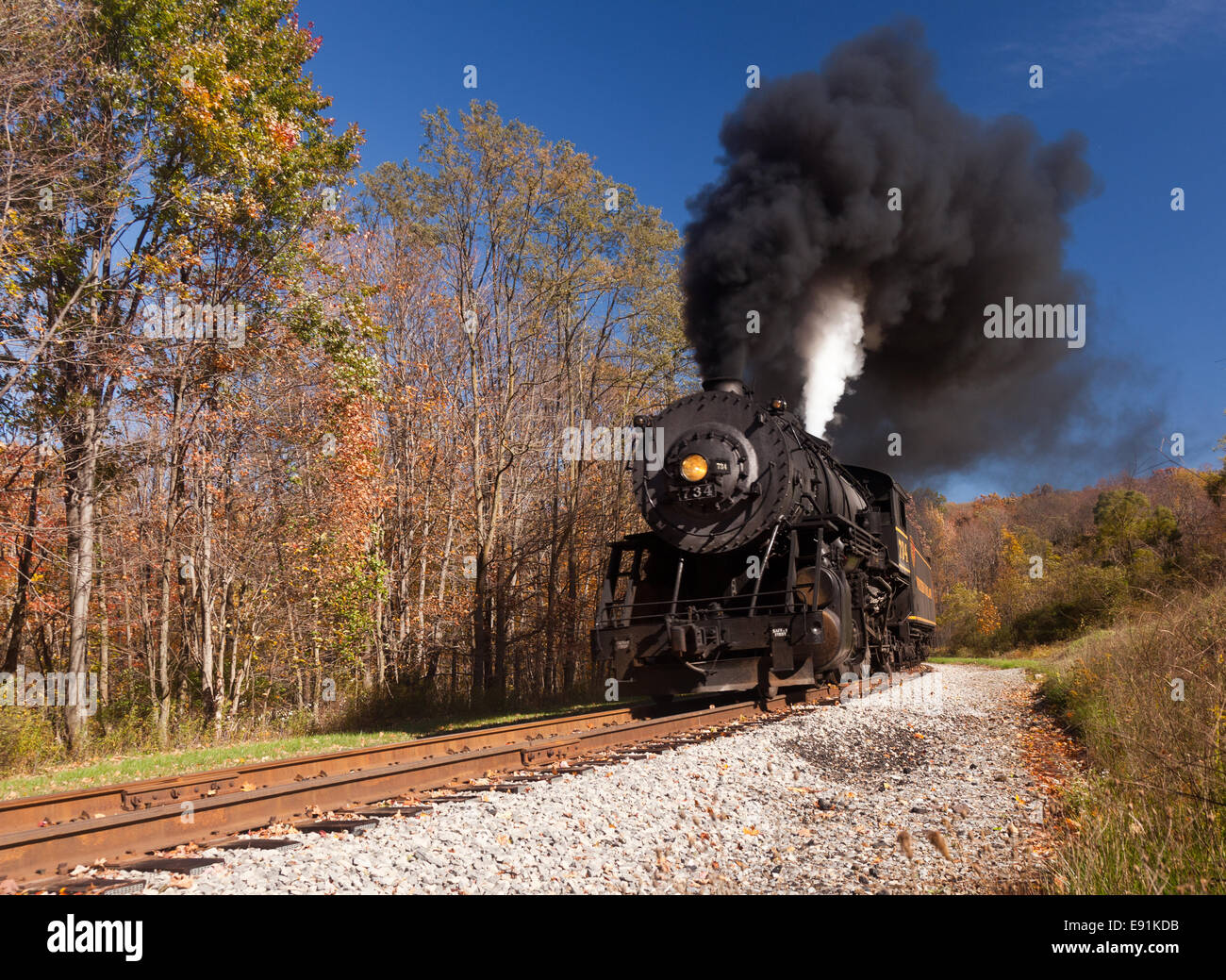 WM Steam train powers along railway Stock Photo - Alamy