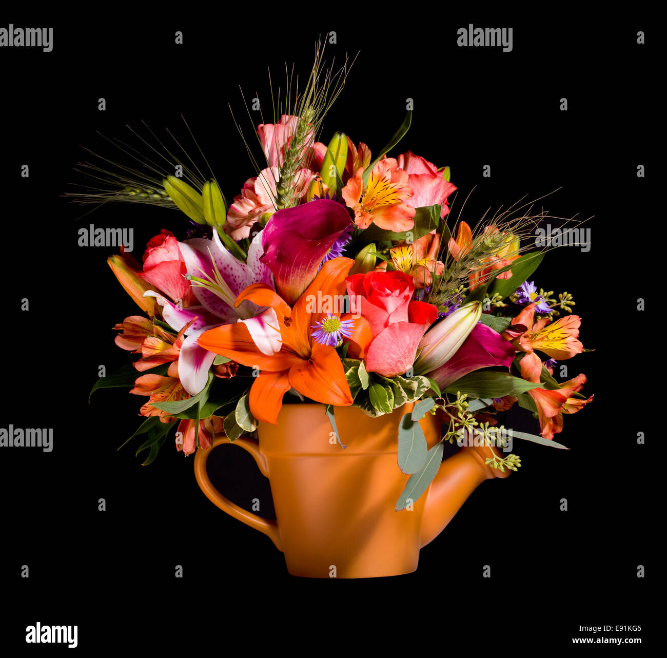 Bouquet of flowers in watering can Stock Photo - Alamy