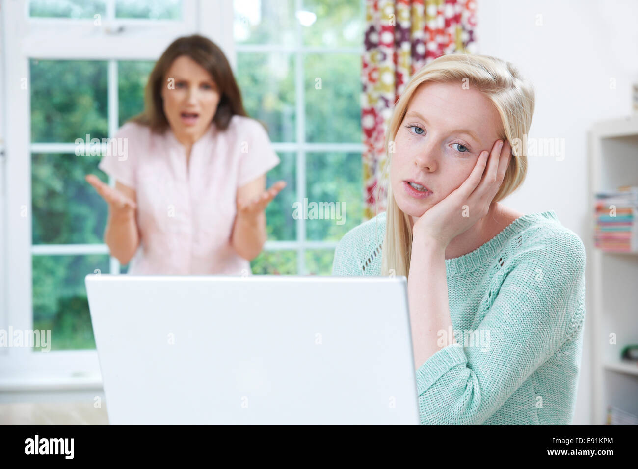 Mother Arguing With Teenage Daughter Over Online Activity Stock Photo ...
