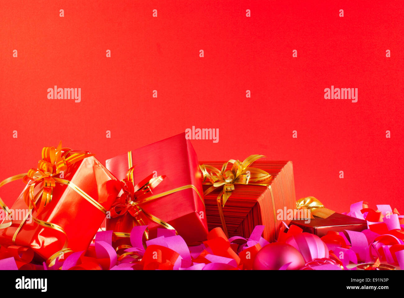 Christmas gifts over red background Stock Photo - Alamy