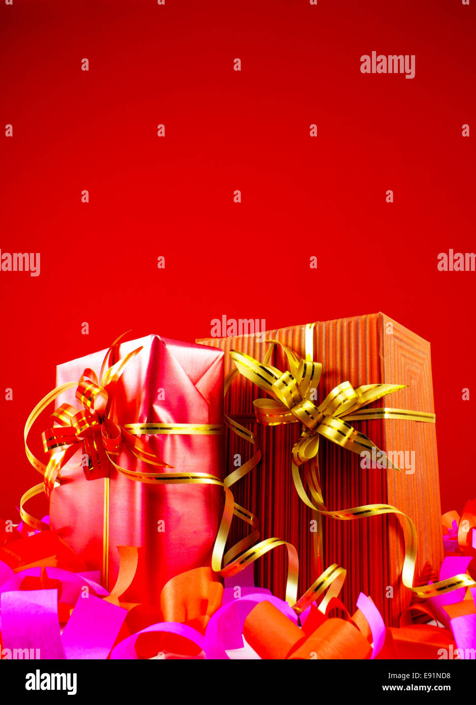 Presents in red boxes against red background Stock Photo - Alamy