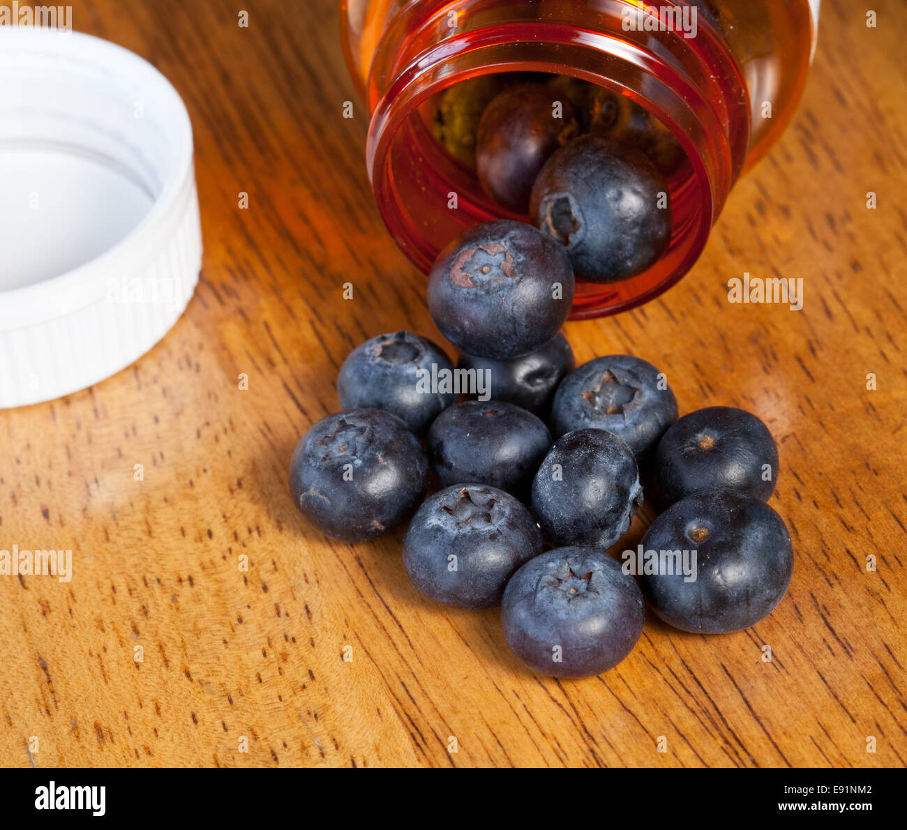 Blueberries in drug bottle Stock Photo - Alamy