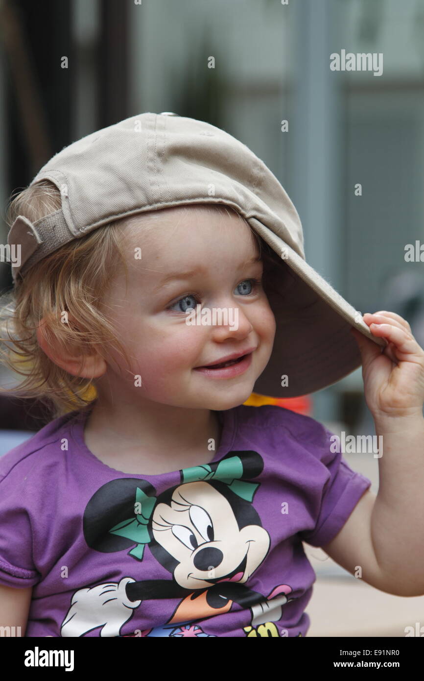 Little Girl with Baseballcap Stock Photo - Alamy