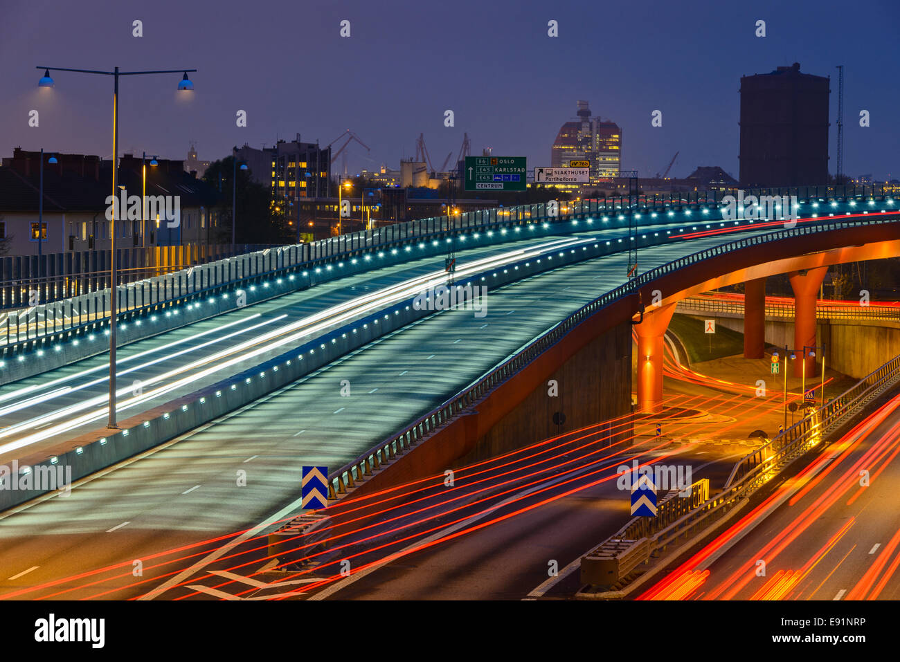 Empty, illuminated city overpass at night Stock Photo - Alamy