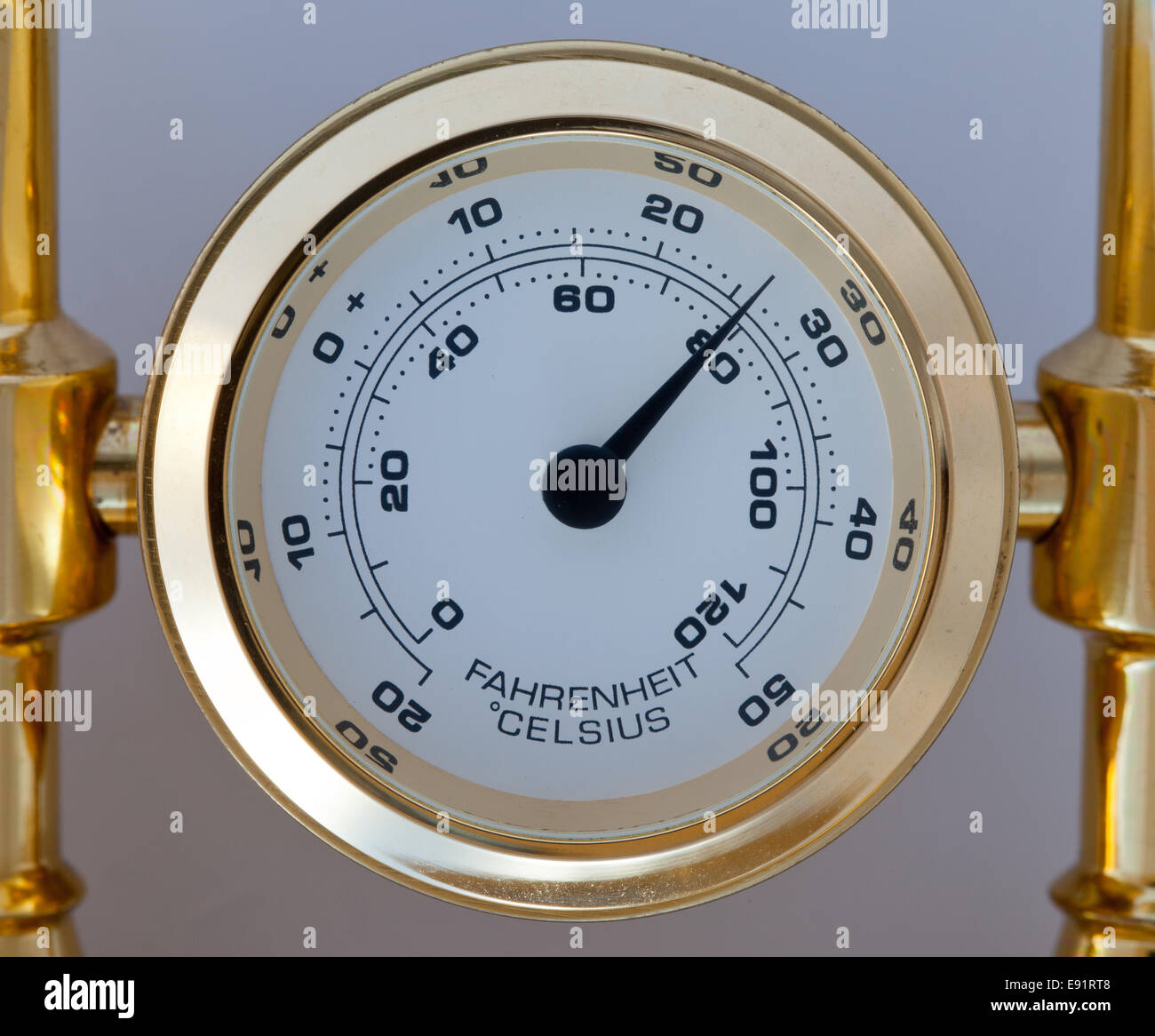 Gold colored thermometer Stock Photo - Alamy