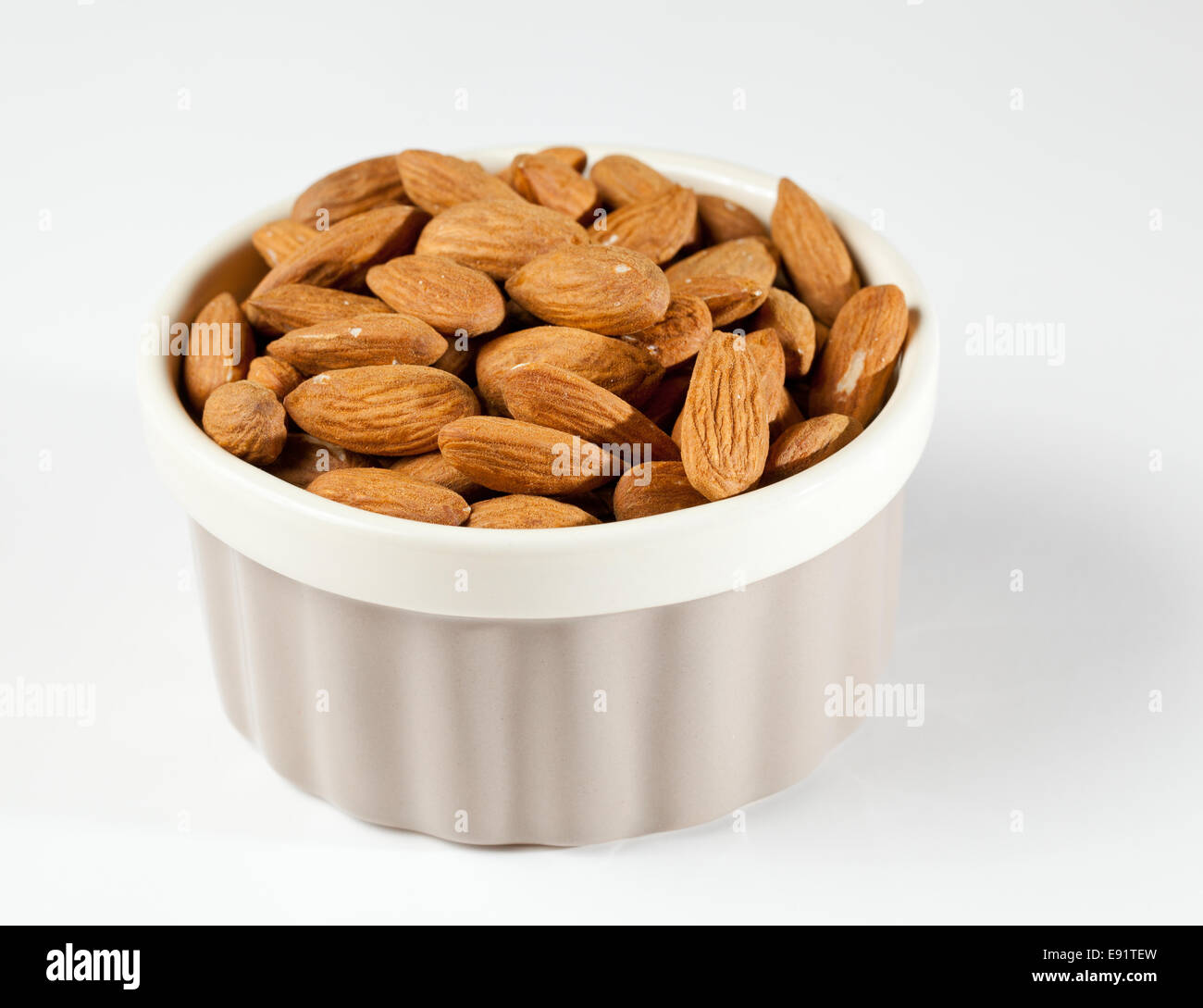 Almonds in porcelain bowl hi-res stock photography and images - Alamy