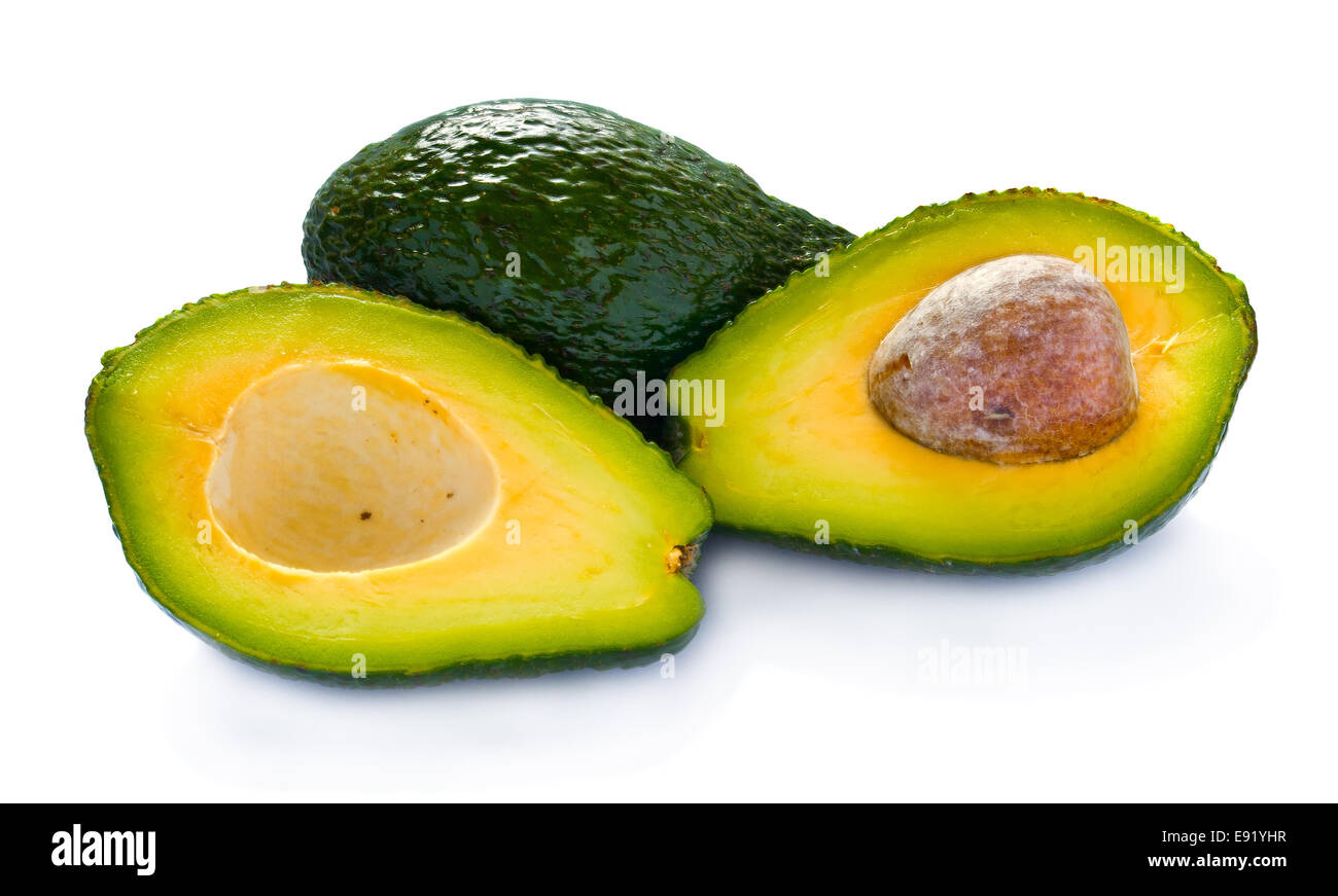 Avocado cut in half against white background Stock Photo - Alamy