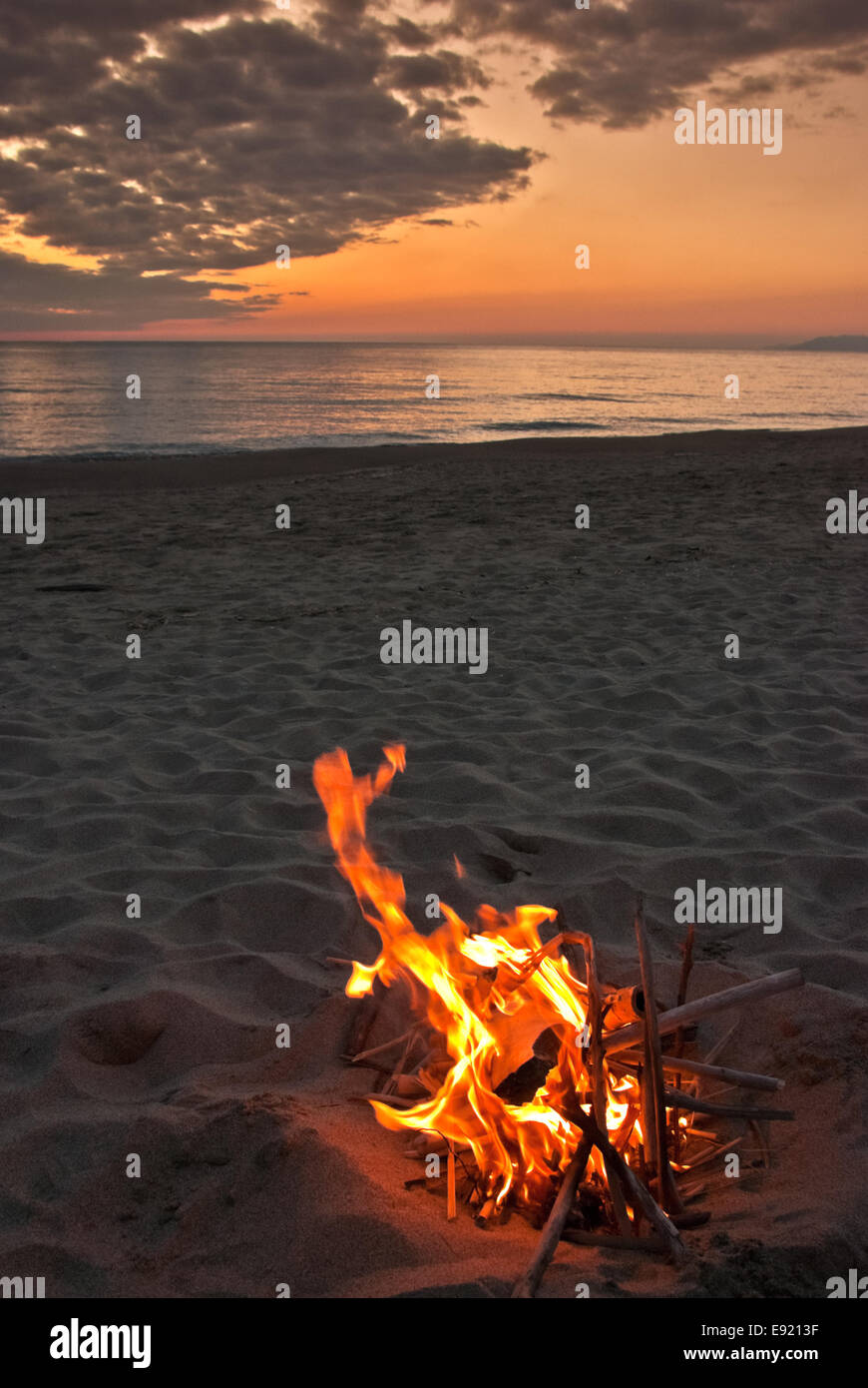 Fire at the beach Stock Photo - Alamy