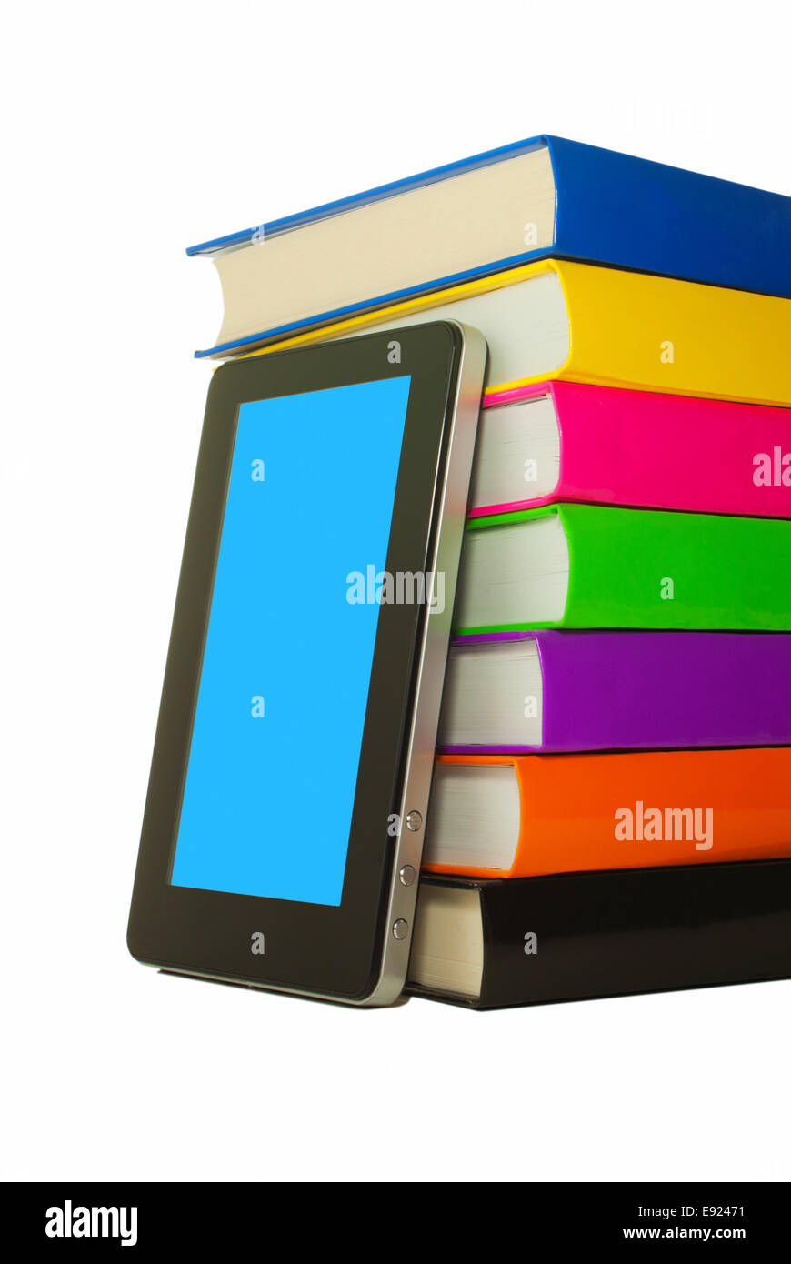 Stack of colorful books and tablet PC Stock Photo - Alamy