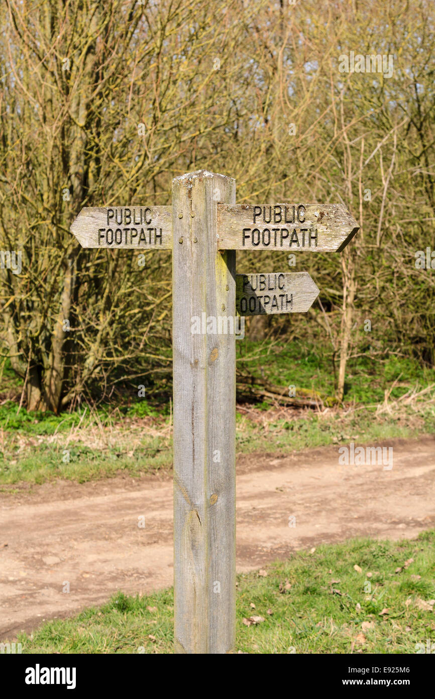 Public footpath sign against a forest background and dirt track Stock ...