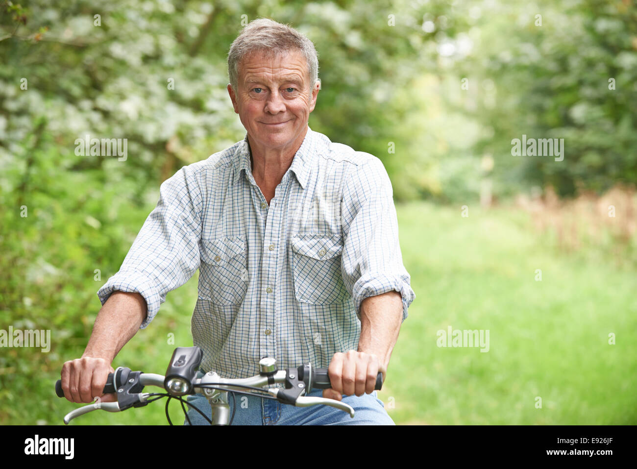Senior Man Enjoying Cycle Ride In The Countryside Stock Photo - Alamy
