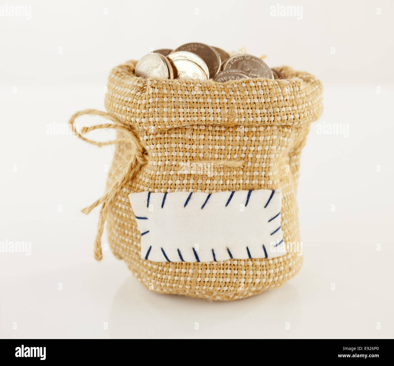 Sack full of coins Stock Photo - Alamy